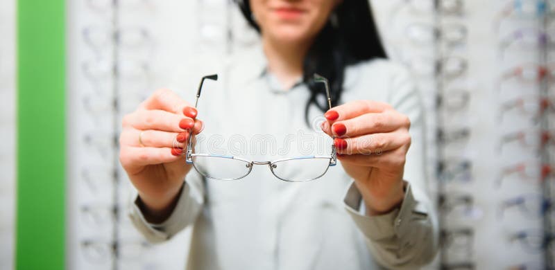 Closeup of Optometrist, Optician Giving Glasses To Try. Stock Image ...