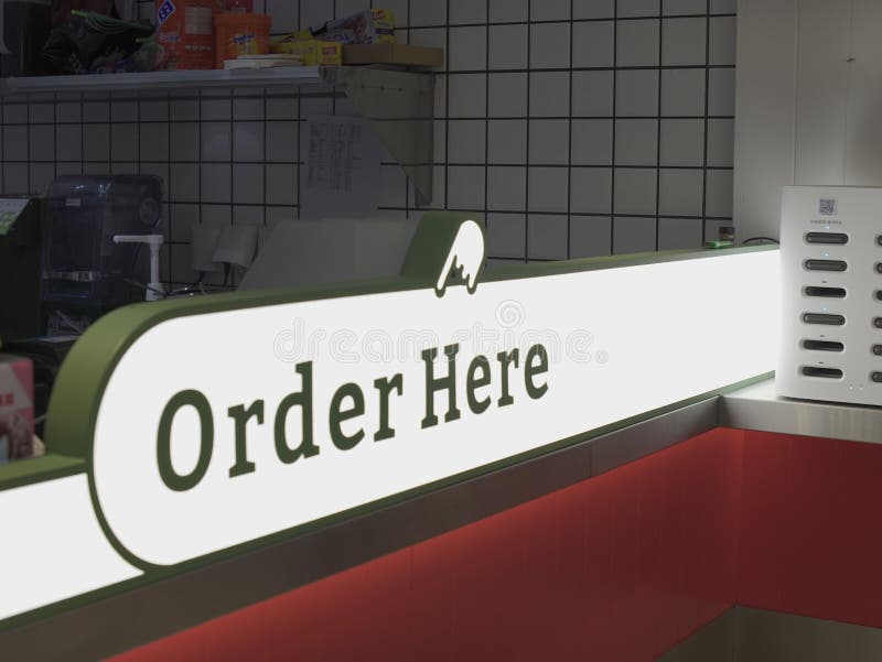 Closeup of "order Here" Sign in a Restaurant Editorial Stock Image ...