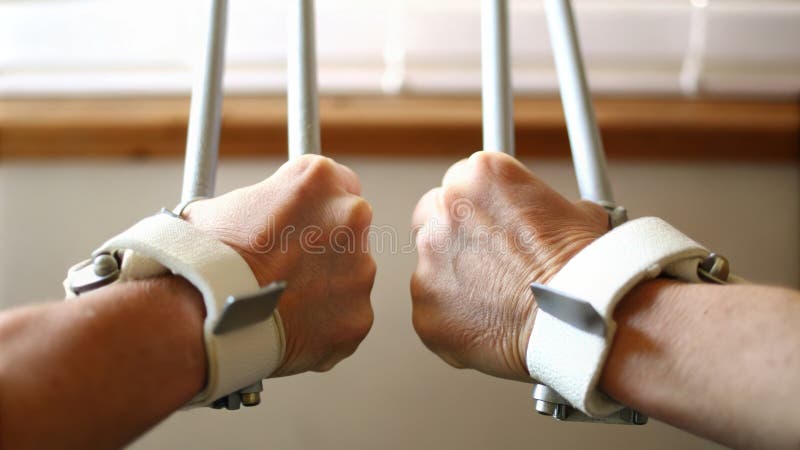 A Closeup of a Pair of Hands within an Exoskeleton Gripping Tools ...