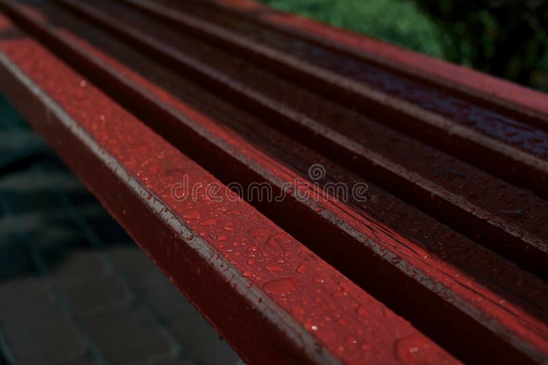 Closeup Part of a Dark Red Bench on the Street Stock Photo - Image of ...