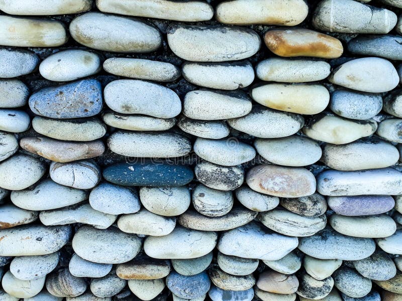 Closeup of a Pebble Wall Under the Sunlight - Perfect for Wallpapers ...