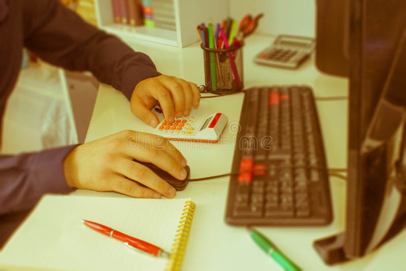 Closeup Pen on Paperwork Accounts with Man Use Computer To Save Data in ...