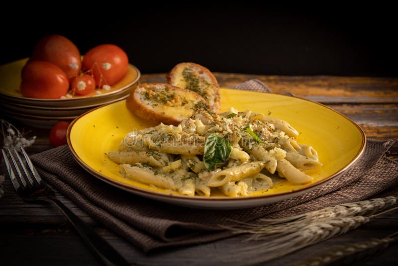 Closeup of Penne Pasta with Garlic Bread. Stock Image - Image of ...