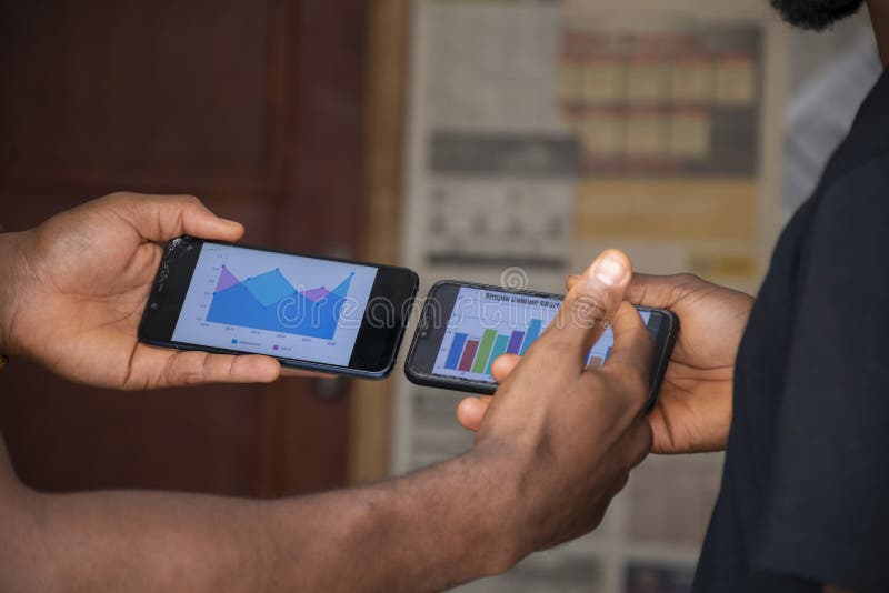 Closeup of People Comparing Different Charts on Mobile Devices - Future ...