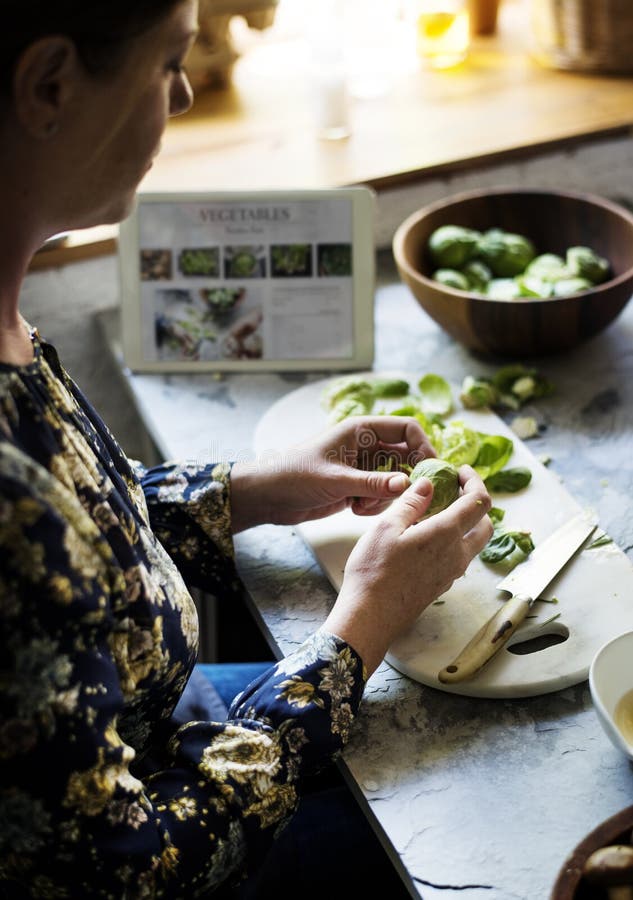 Closeup of People Preparing Vegetable To Be Cooked in the Kitchen Stock ...