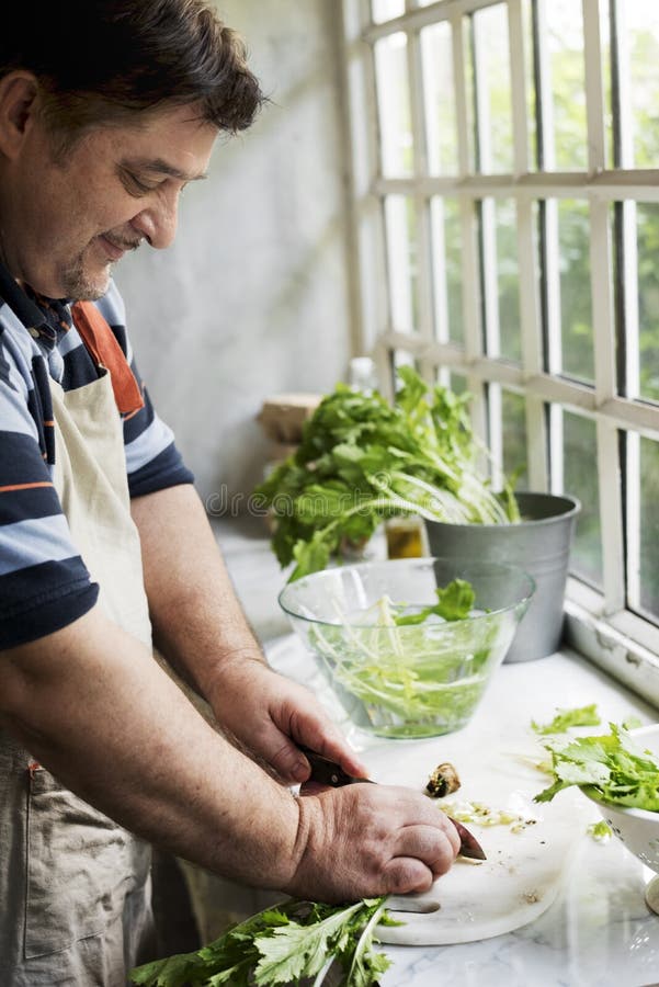 Closeup of People Preparing Vegetable To Be Cooked in the Kitchen Stock ...