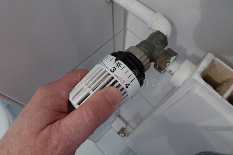 Closeup of a Person Adjusting the Heater Temperature Controller Stock ...