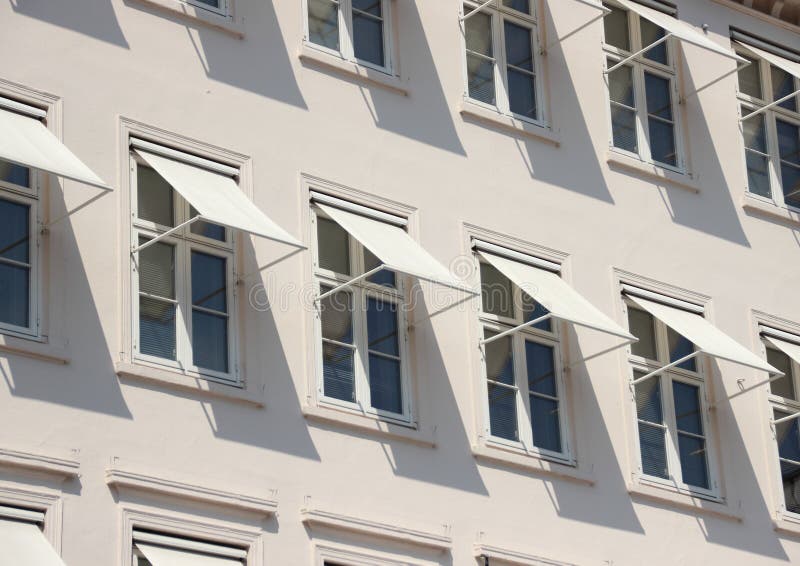 Closeup Perspective on Grey Building with White Awning Stock Image ...