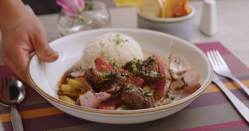Closeup of Peruvian Sauteed Loin with Rice Being Served on a Restaurant ...