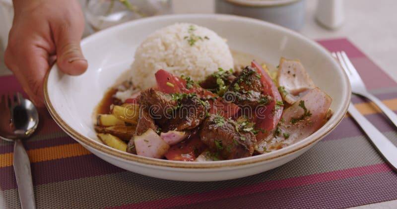 Closeup of Peruvian Sauteed Loin with Rice Being Served on a Restaurant ...