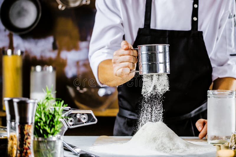 Cooking, Profession and People Concept - Male Chef Cook Making Food at ...