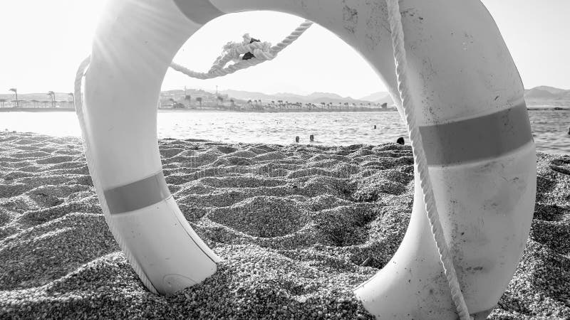 Closeup Photo of Beautiful Sandy Sea Beach and Life Saving Ring Stock ...