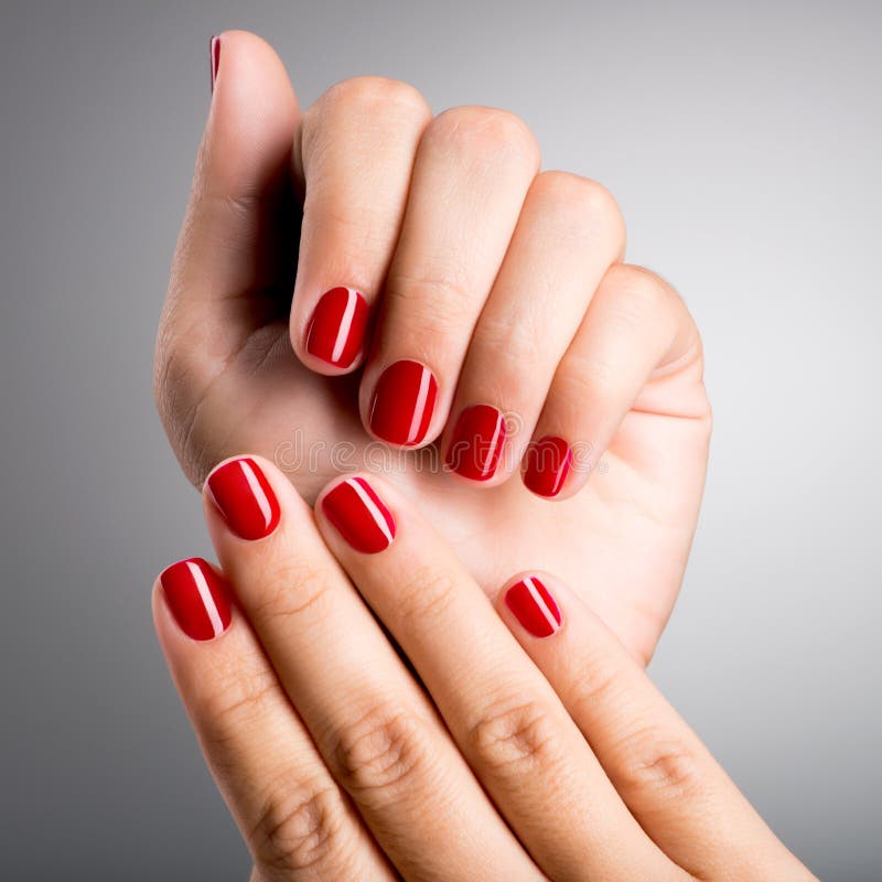 Closeup Photo of a Female Hands with Red Nails Stock Photo - Image of ...