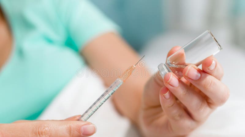 Closeup Photo of Nurse Preparing Syringe for Injection Stock Photo ...