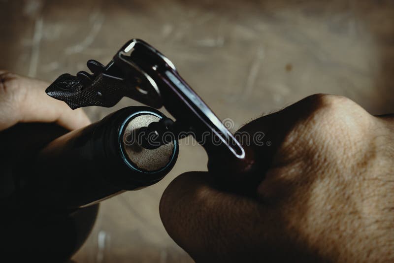 Hand Using Corkscrew To Extract Cork from a Bottle Stock Photo - Image ...