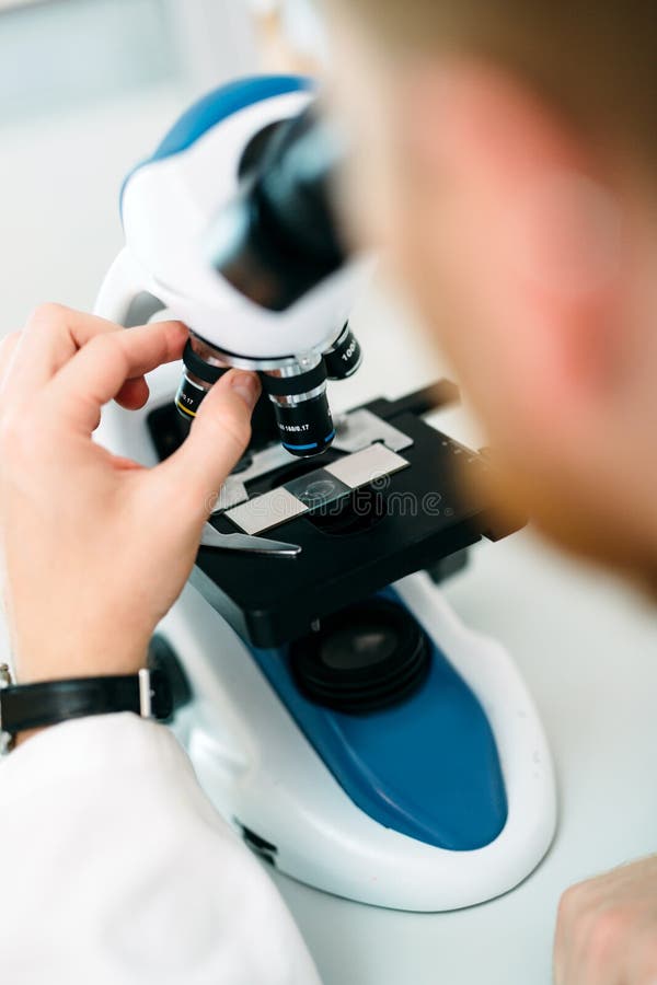 Closeup Microscope Lens on Gray Background in Laboratory Stock Photo ...