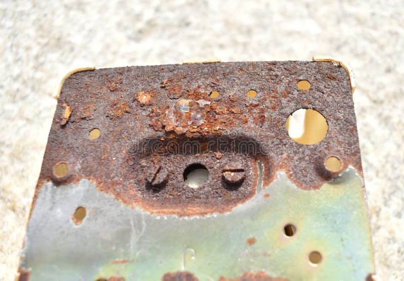 A Closeup Picture of a Rusted Iron Plate with a Tin Coating. Oxidation ...