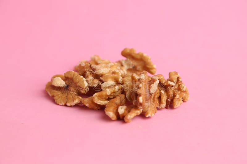 Closeup of a Pile of Walnut Kernels on a Pink Surface Stock Image ...
