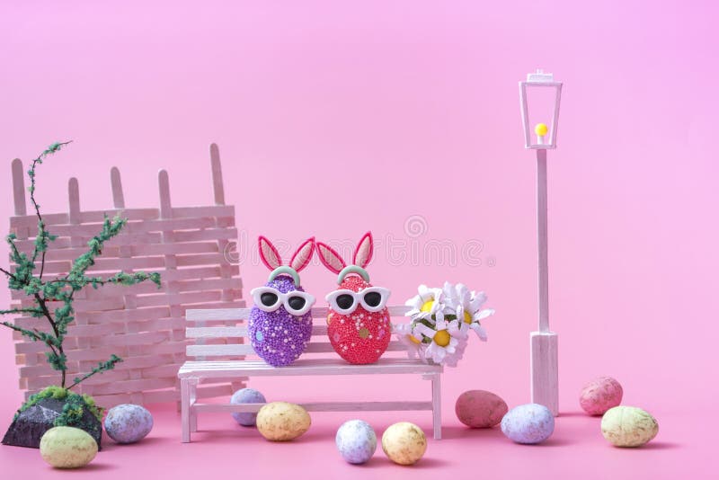 Closeup on a Pink Background Multi-colored Eggs on a White Bench ...