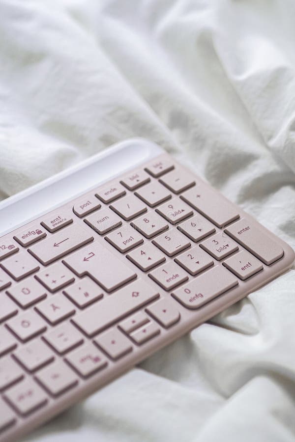 Closeup of a Pink Keyboard on a White Bed Stock Image - Image of modern ...