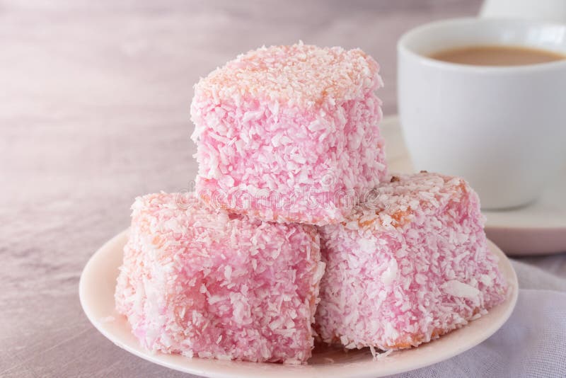CloseUp of Pink Lamingtons with Tea Stock Image - Image of traditional ...