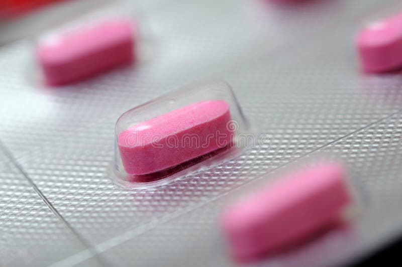 Pink Medicine for Stomach Aches Stock Photo - Image of preventative ...