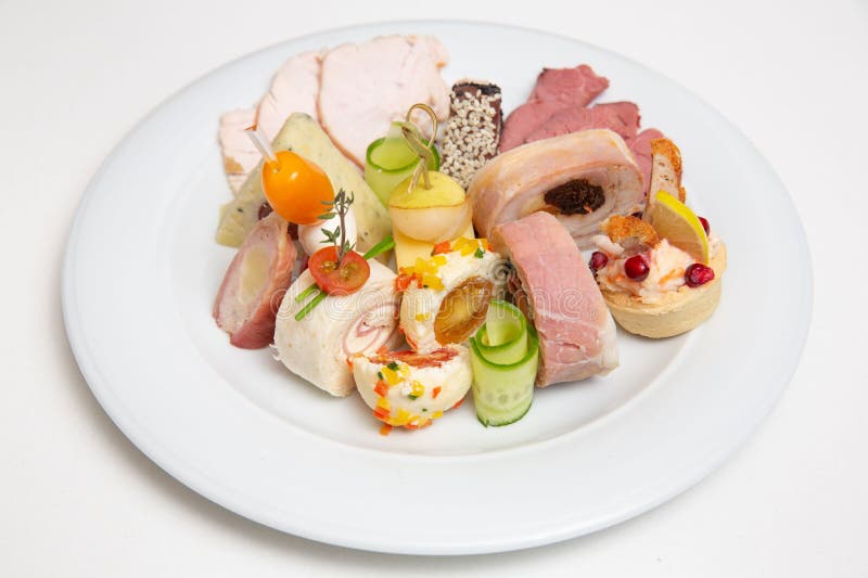 Closeup of a Plate with Different Types of Cheese and Ham. Stock Photo ...