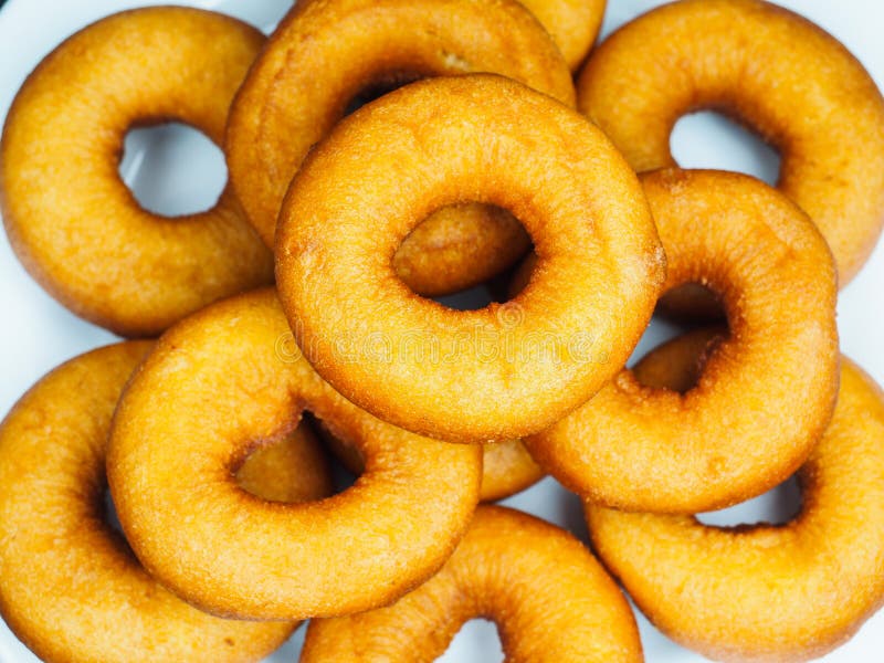 Closeup of a Plate with Freshly Made Brown Doughnuts Stock Image ...