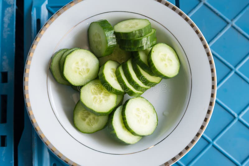 Plate with sliced cucumber stock image. Image of dieting - 123480011