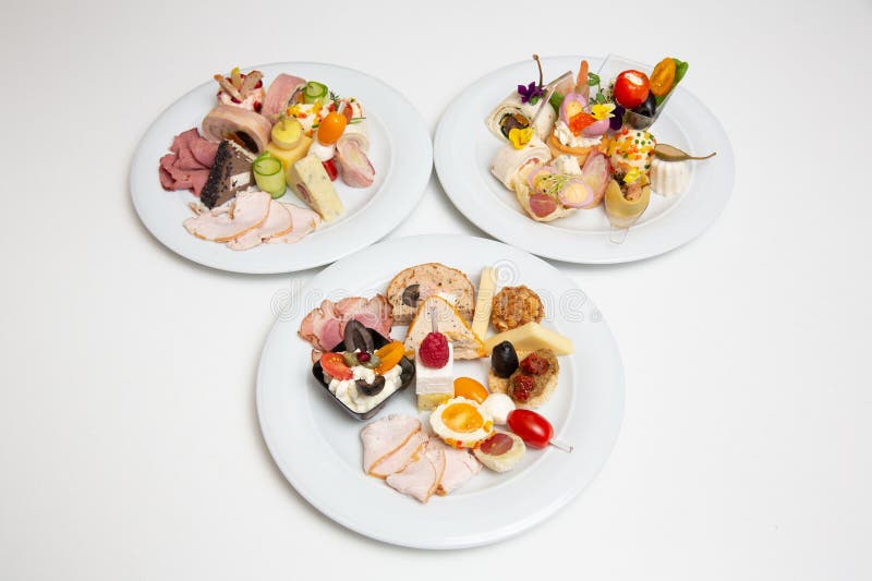 Closeup of Plates with Different Types of Cheese and Ham. Stock Image ...