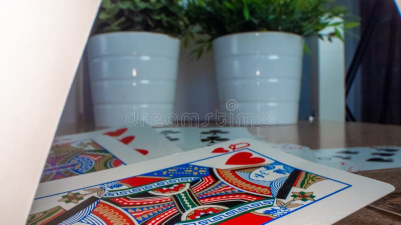 Closeup of Playing Cards and Ceramic Pots with Plants in the Back Stock ...
