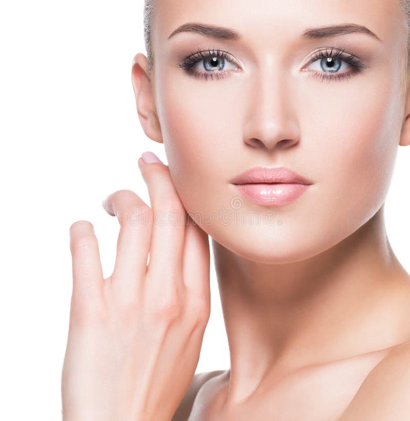 Closeup Portrait Of Beautiful Young Woman With Flower Near Face Stock