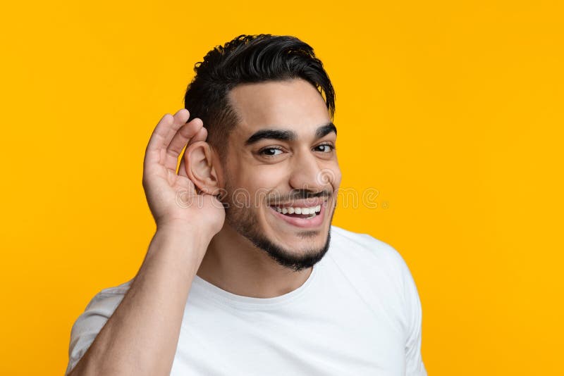 Closeup Portrait Of Cheerful Arab Guy Eavesdropping And Smiling Stock ...