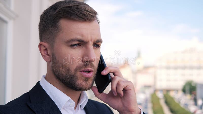 Closeup Portrait Face of Focused Man Talking on Mobile Phone on the ...
