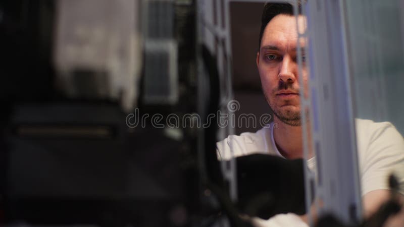 Closeup Portrait of Focused Serious Computer Master Assembling Modern ...