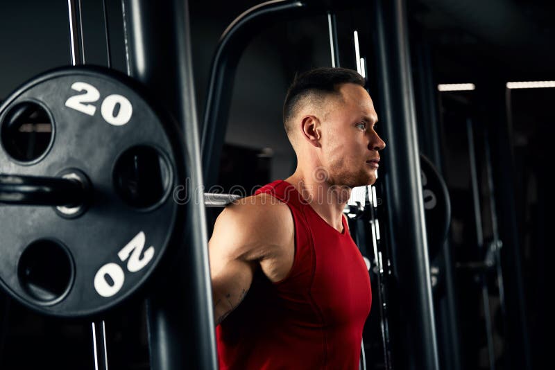 Closeup Portrait Of A Muscular Man Workout With Barbell At Gym Brutal