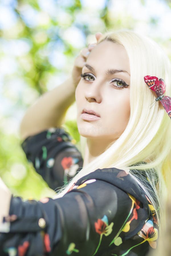 Closeup Portrait Of Sensual Caucasian Blond Woman Posing Outdoor Stock