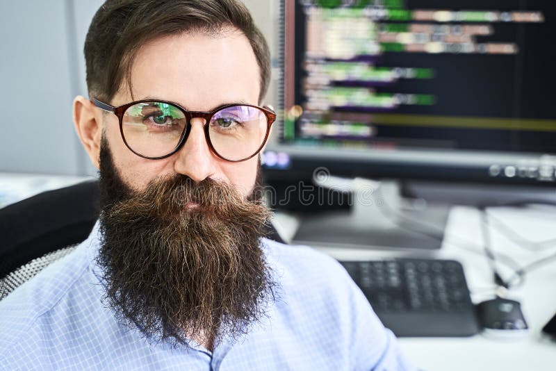 Closeup Portrait of a Serious Computer Programmer Developer Working in ...