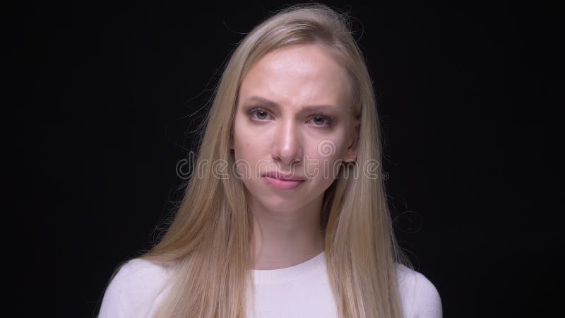 Closeup Portrait Of Young Pretty Blonde Female Face With Eyes Looking