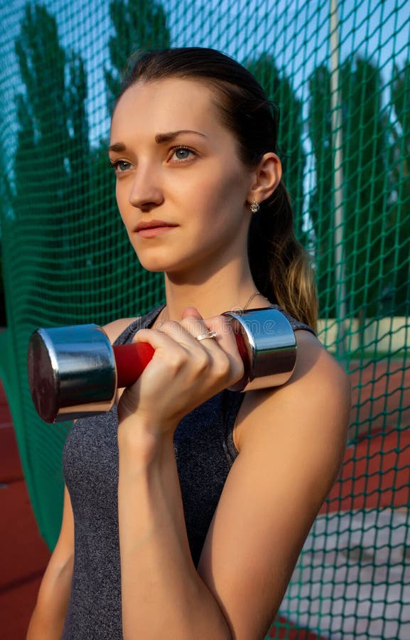 Closeup Portrait Of Young Sporty Girl Doing Exercises With The D Stock