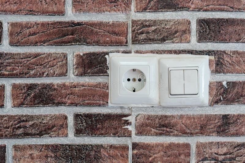 Closeup of Power Outlets on the Brick Wall Texture Stock Image - Image ...