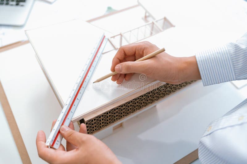 Closeup of Professional Architect Hand Measuring House Model ...