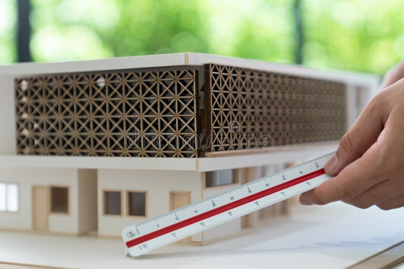 Closeup of Professional Architect Hand Measuring House Model ...