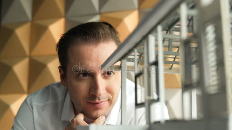Closeup of Professional Engineer Face Looking at House Model ...