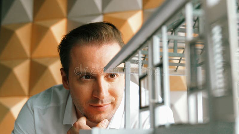 Closeup of Professional Engineer Face Looking at House Model ...