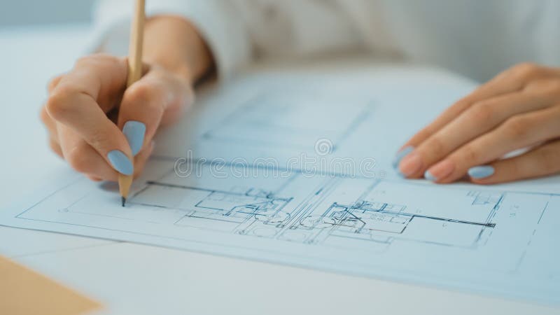 Closeup of Professional Female Engineer Hand Drawing Blueprint ...