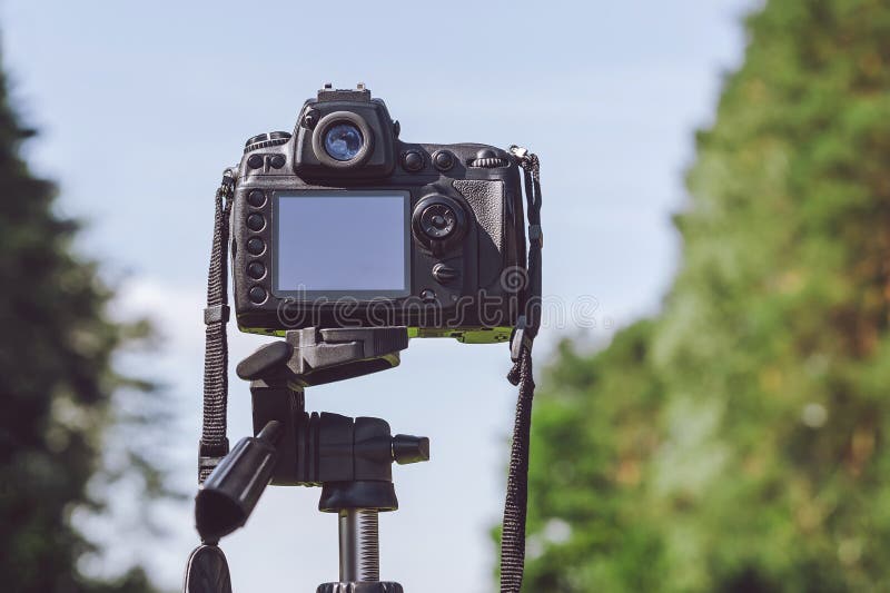 Closeup Professional Photo Video Camera. Background of Nature and Sky ...