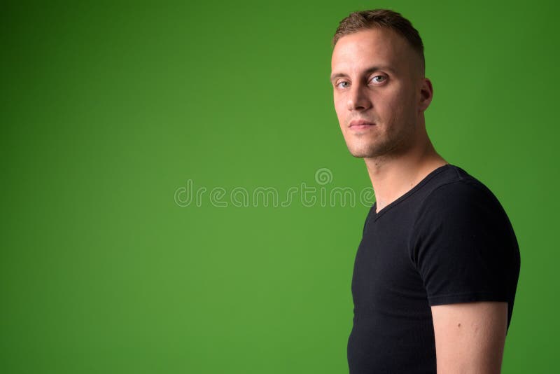 Closeup Profile View of Handsome Man Looking at Camera Stock Photo ...