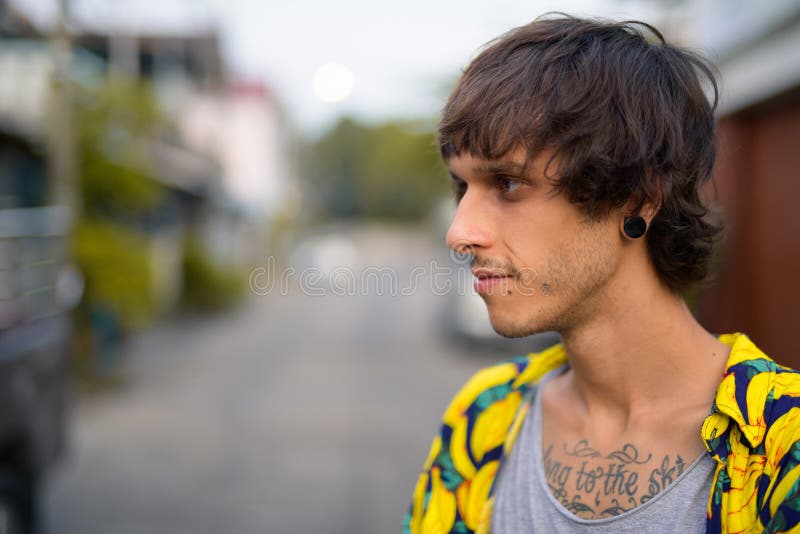 Closeup Profile View of Young Rebellious Man in the Streets Outdoors ...