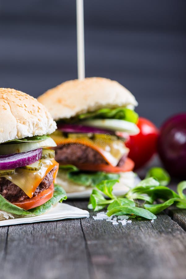 Closeup Pub Style Burger on Table Stock Image - Image of food, cheese ...